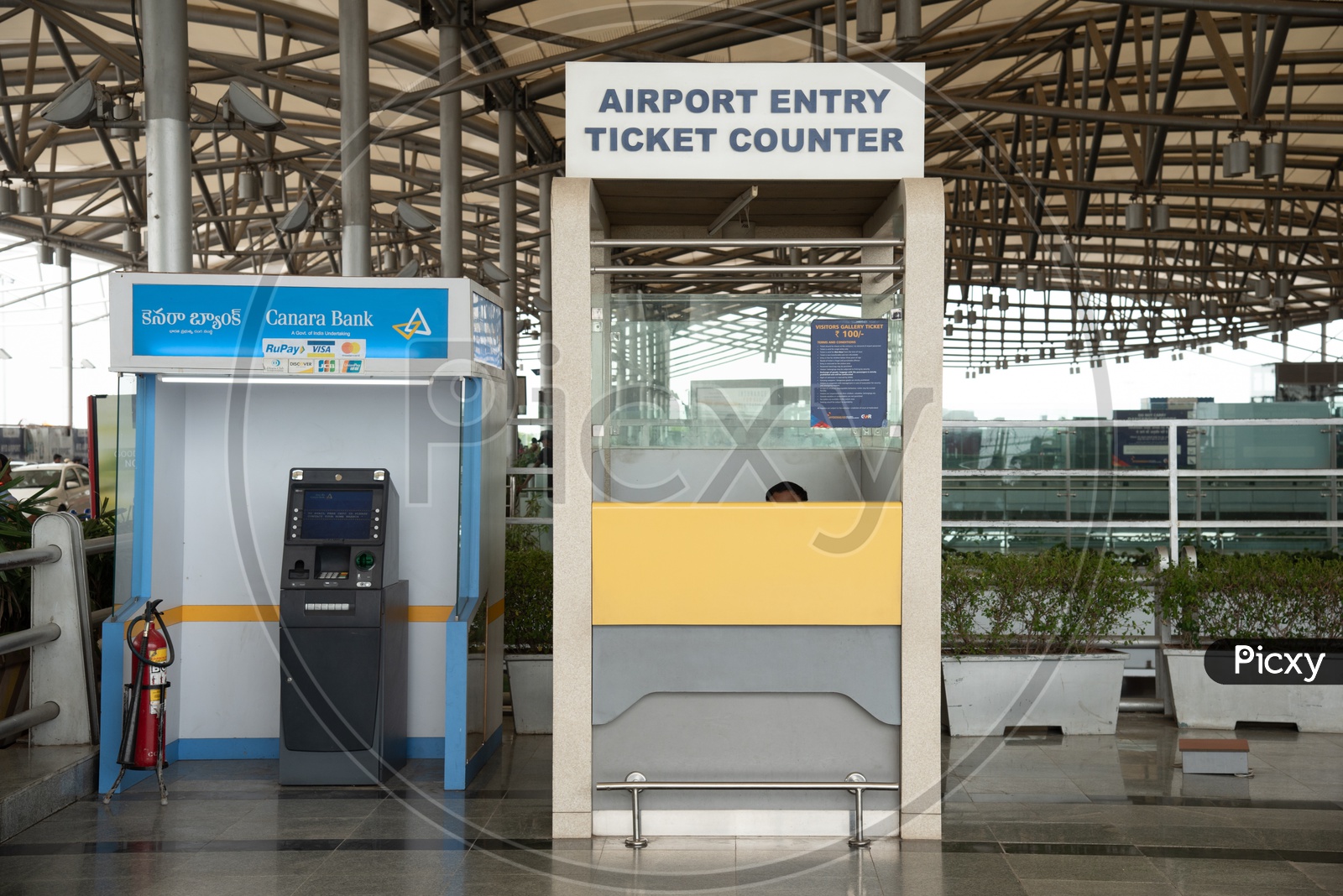 Image of Canara Bank ATM and Airport entry ticket counter-XI568547-Picxy