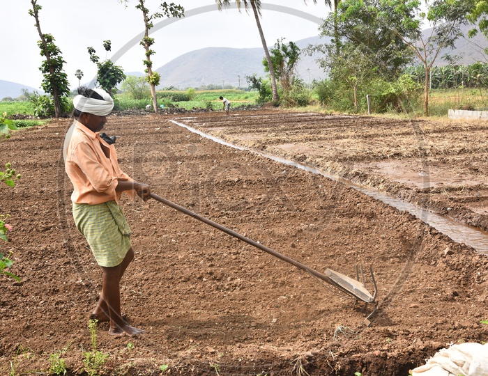 Image of Man plowing a field with a hand plow-ES680717-Picxy