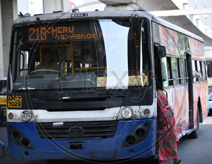 Image of Woman Getting into Bus-TZ772324-Picxy