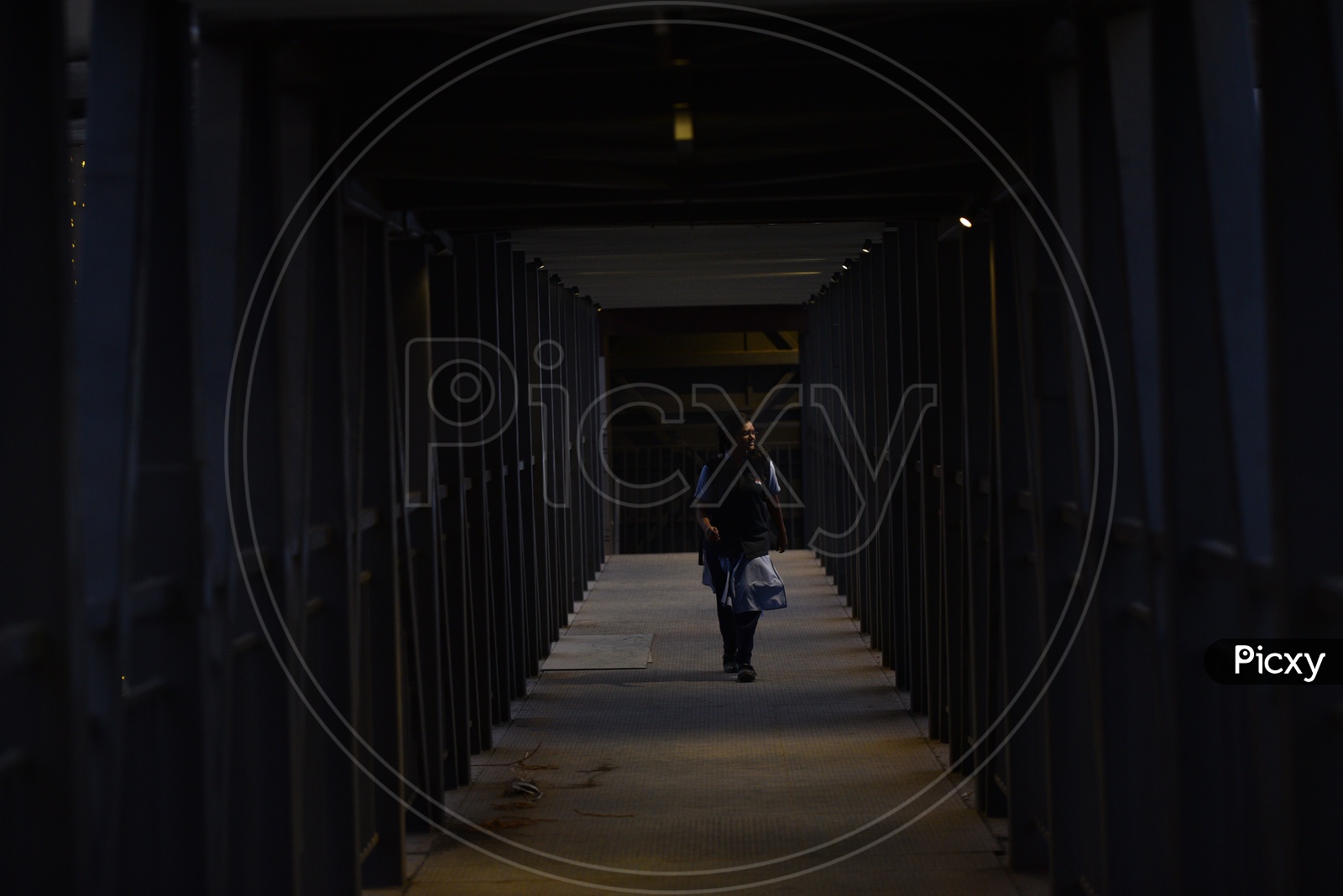 Image of a person walks through a new foot over bridge,kphb-LZ754963-Picxy