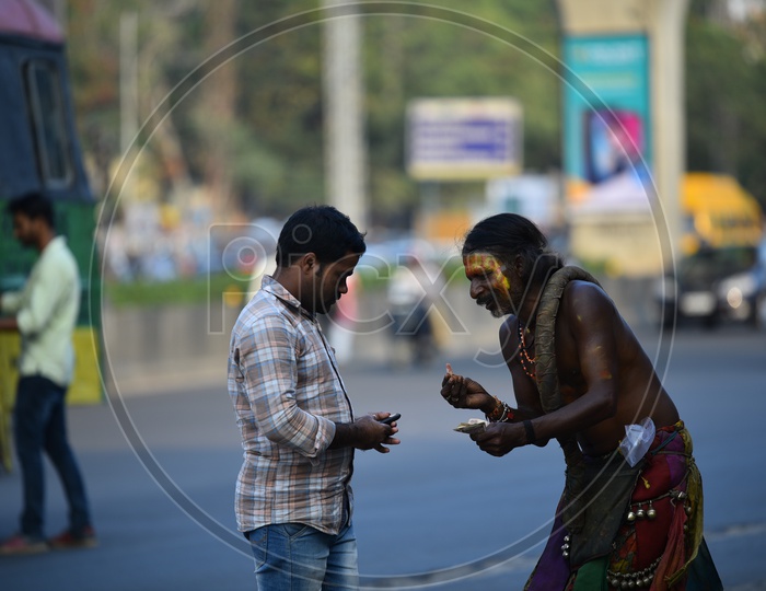 Image of beggars dress up as pothuraju and beg on streets-TA858101-Picxy