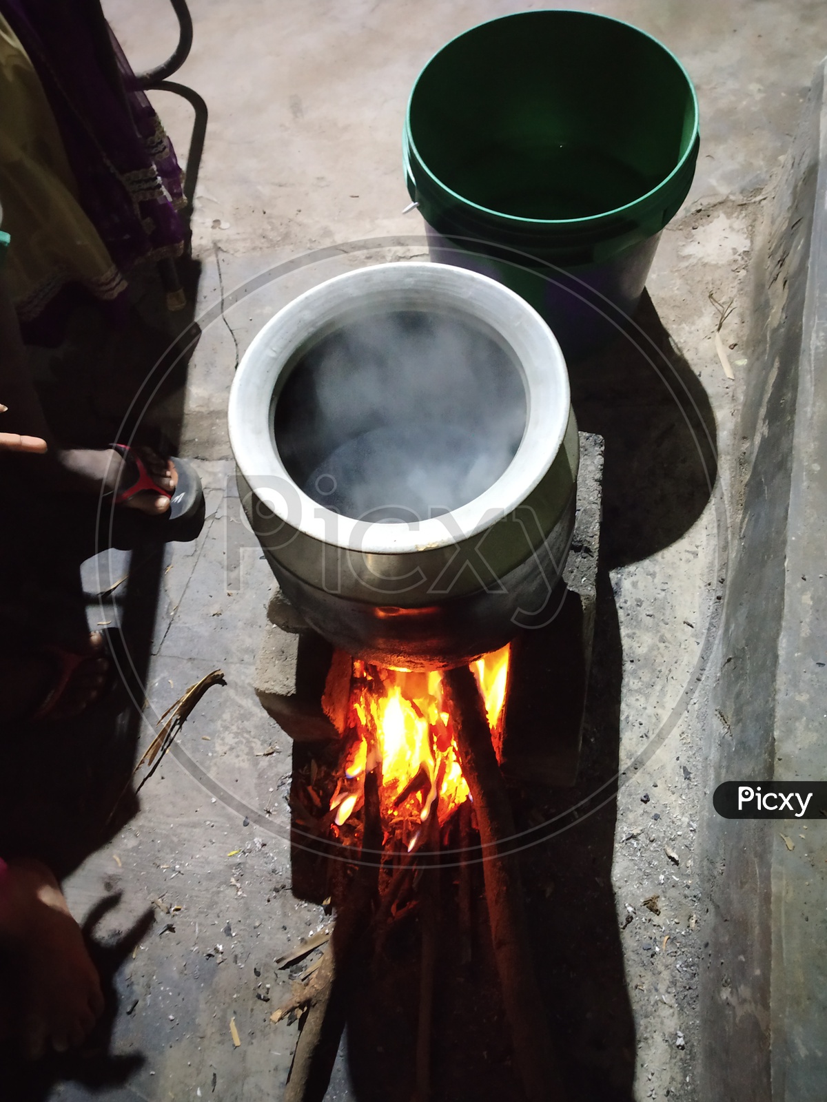 Image of Heating of water in village - Mud/Clay Stove, Wood-YC177509-Picxy