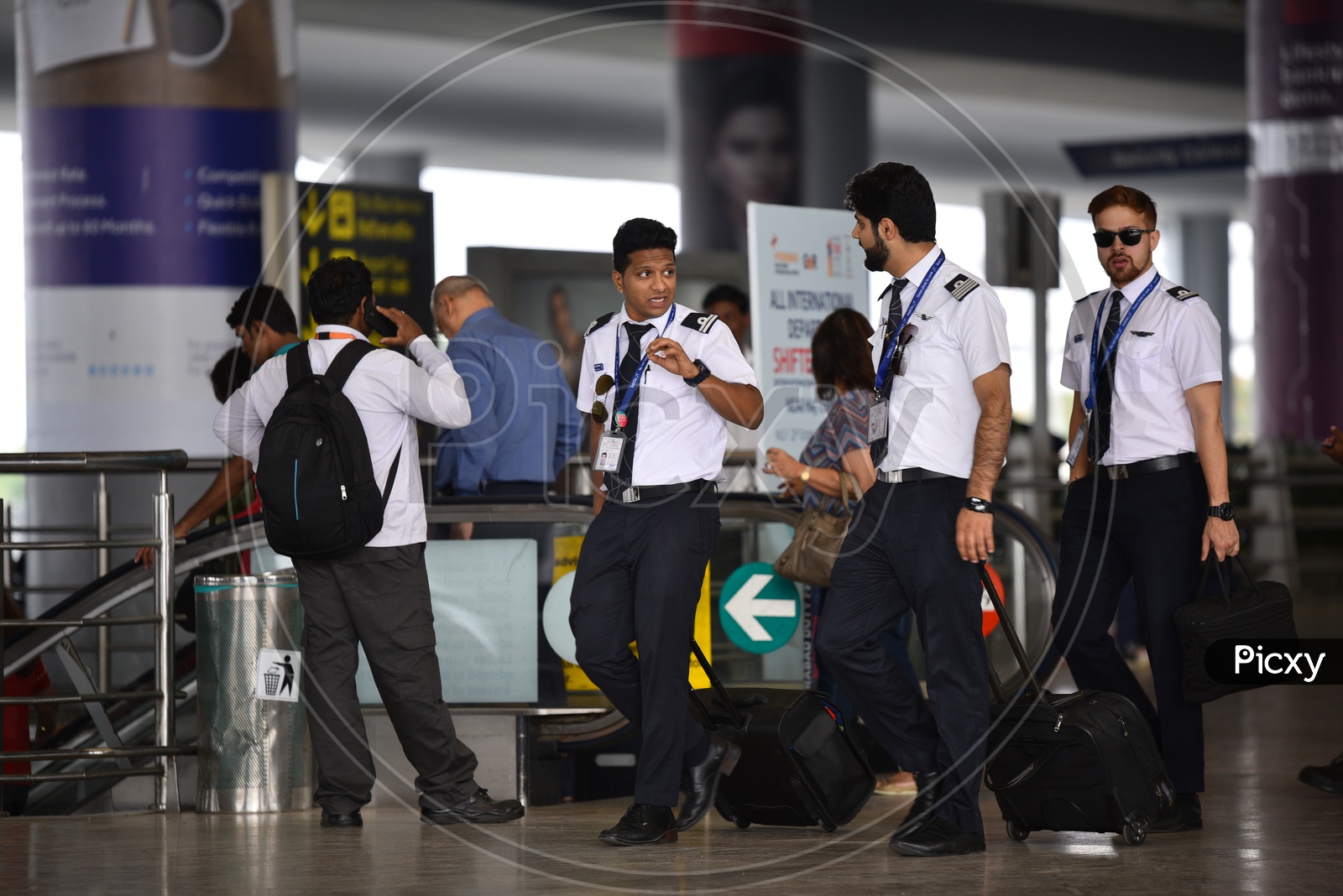 Image of Pilots having a talk to each other at RGI airport.-UM765507-Picxy