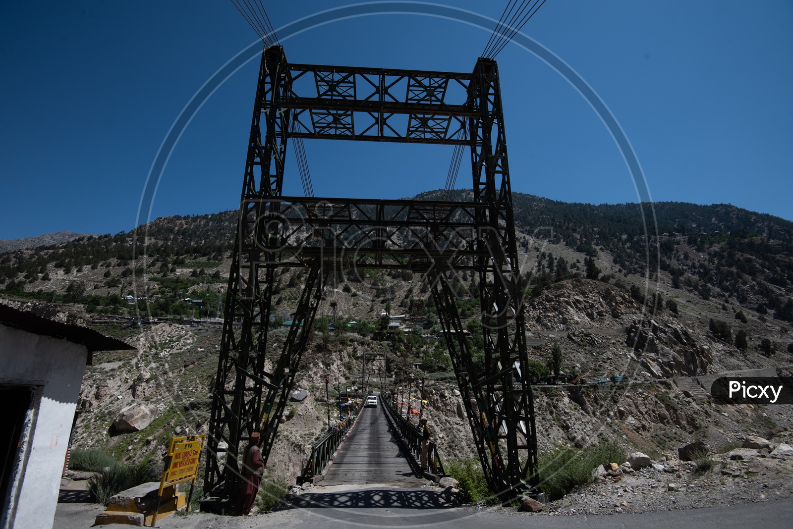 Image of A Car Crossing a Metal Bridge Constructed Over a Water Canals ...