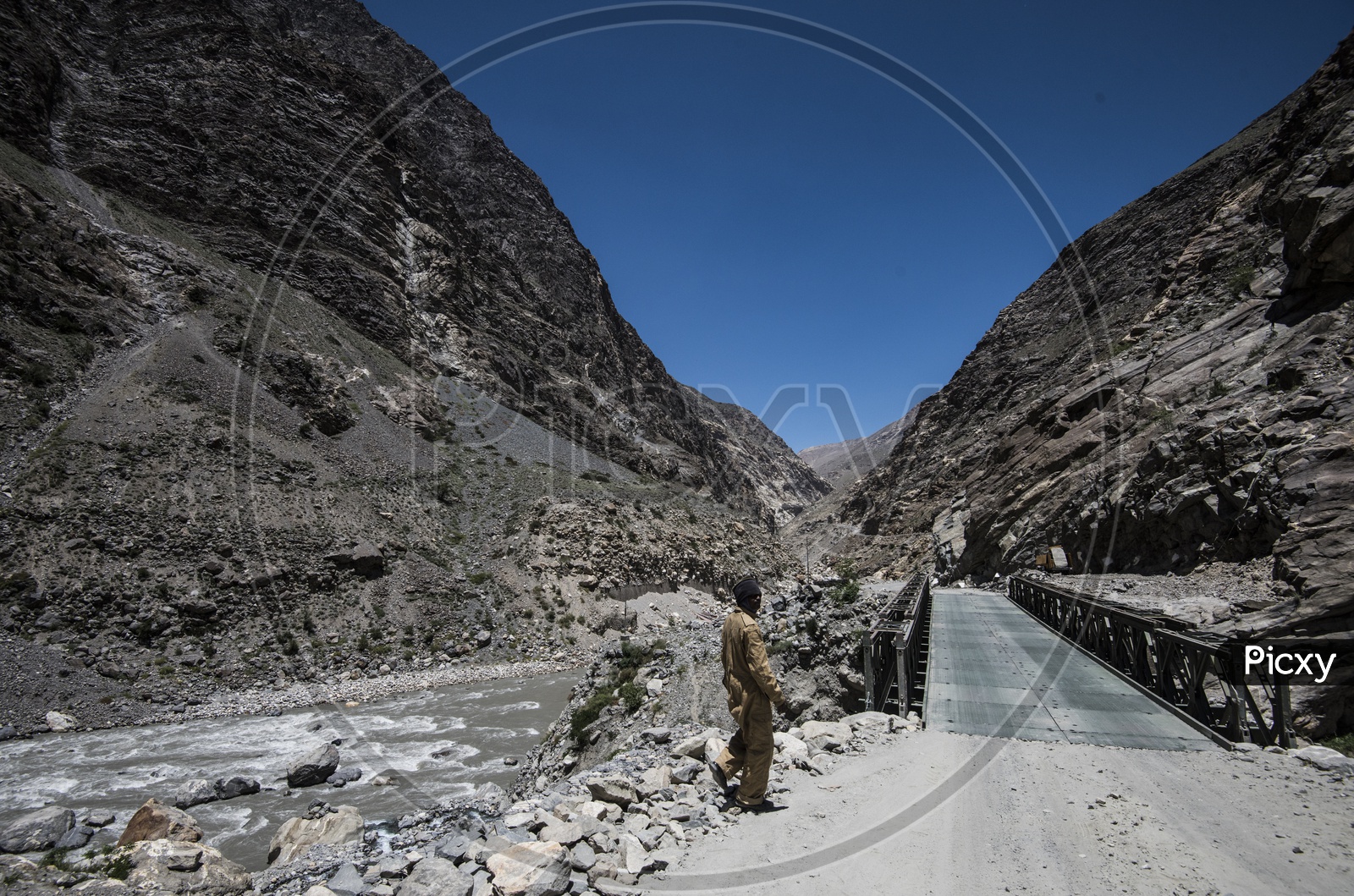 Image of A Bridge Over a Water Canal in Leh / Ladakh With a Worker ...