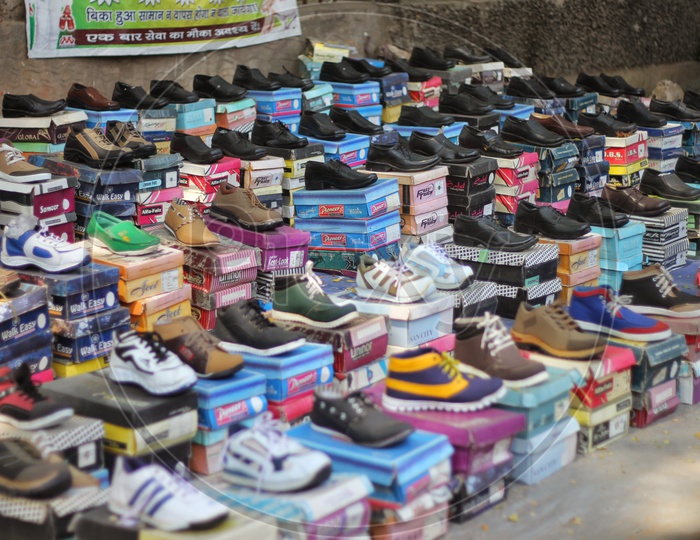 Image of A Shoe Vendor Placed The Shoes on a Road side Symmetrically ...