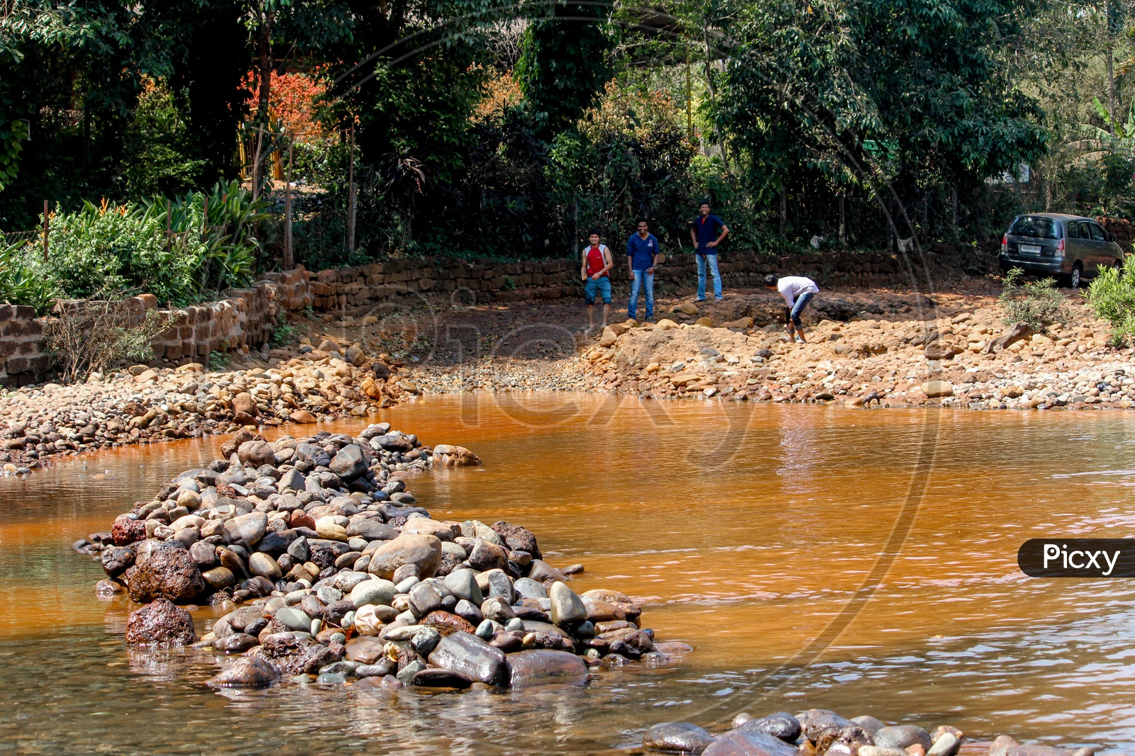 Image of Visitors at Dudhsagar Falls Ready To Cross the Water Pit ...