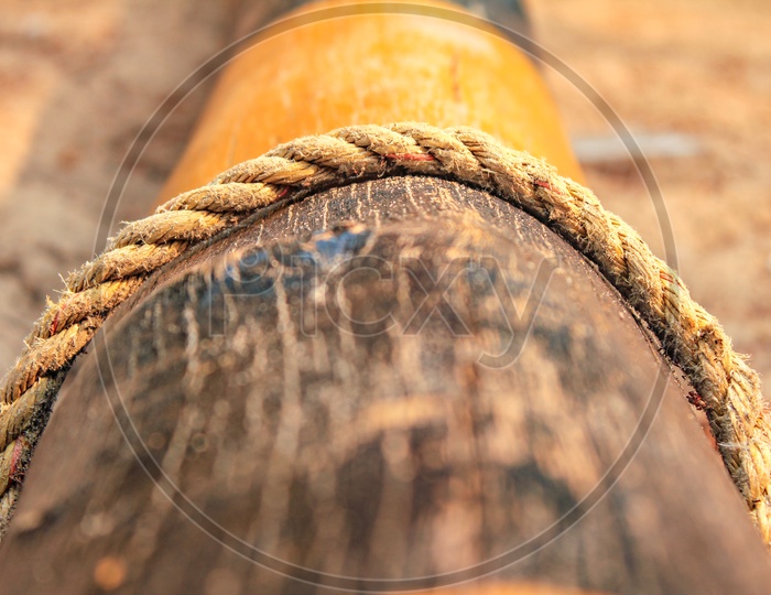 Image of A Thread Knotted To a Wood Log Closeup Shot-SL154969-Picxy