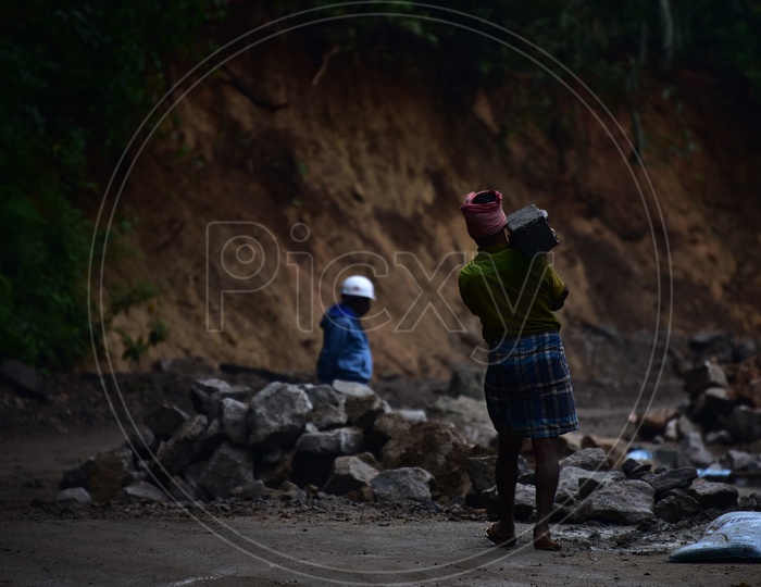 Image of Local Workers in Munnar Carrying Stones as a Part Of Road ...