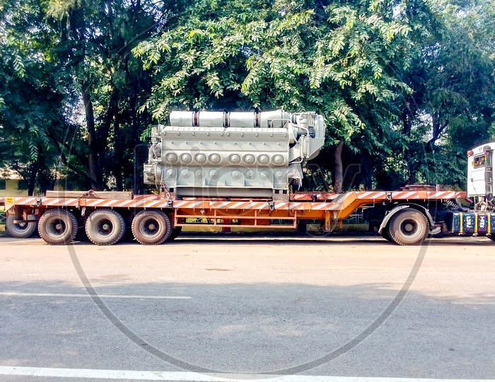 Image of A lorry carrying huge machinery component-VR863444-Picxy