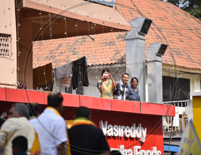 Image of Residents Capturing TDP Road Show in Their Mobiles-PC017695-Picxy