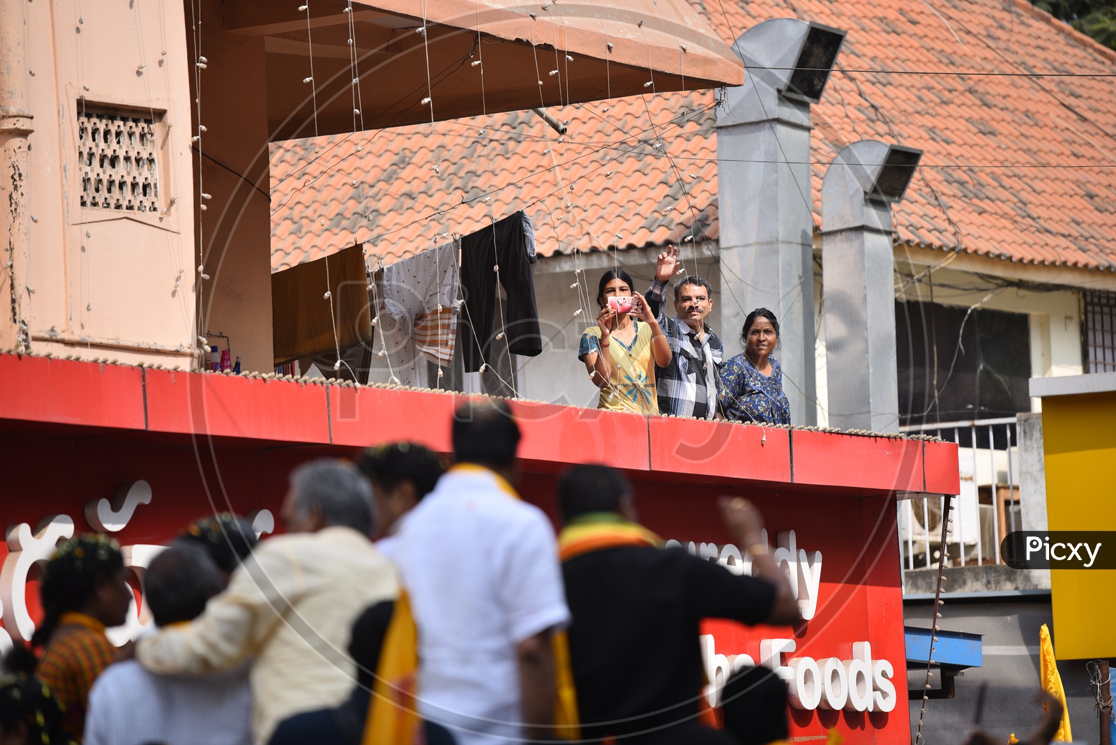 Image of Residents Capturing TDP Road Show in Their Mobiles-PC017695-Picxy