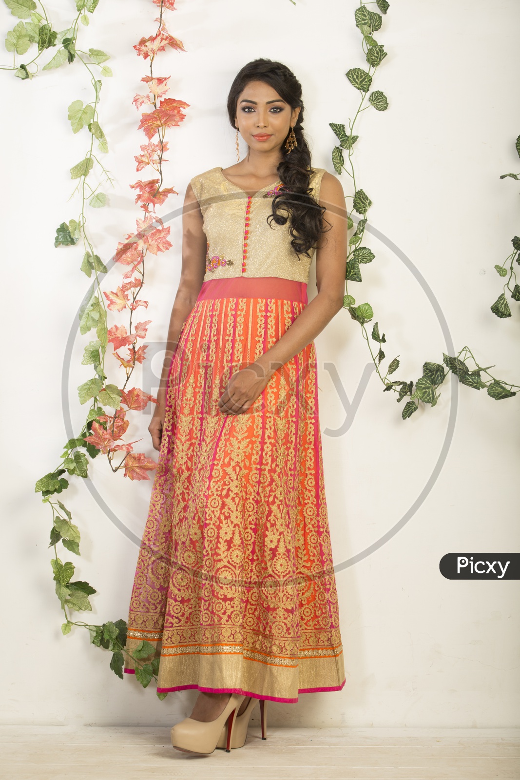 Image of An Indian Female Model Wearing a Colorful Chudidar Over a ...