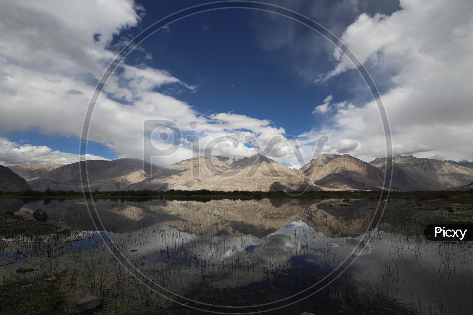 Image of A Beautiful Reflection of Mountains on Water in River valleys ...