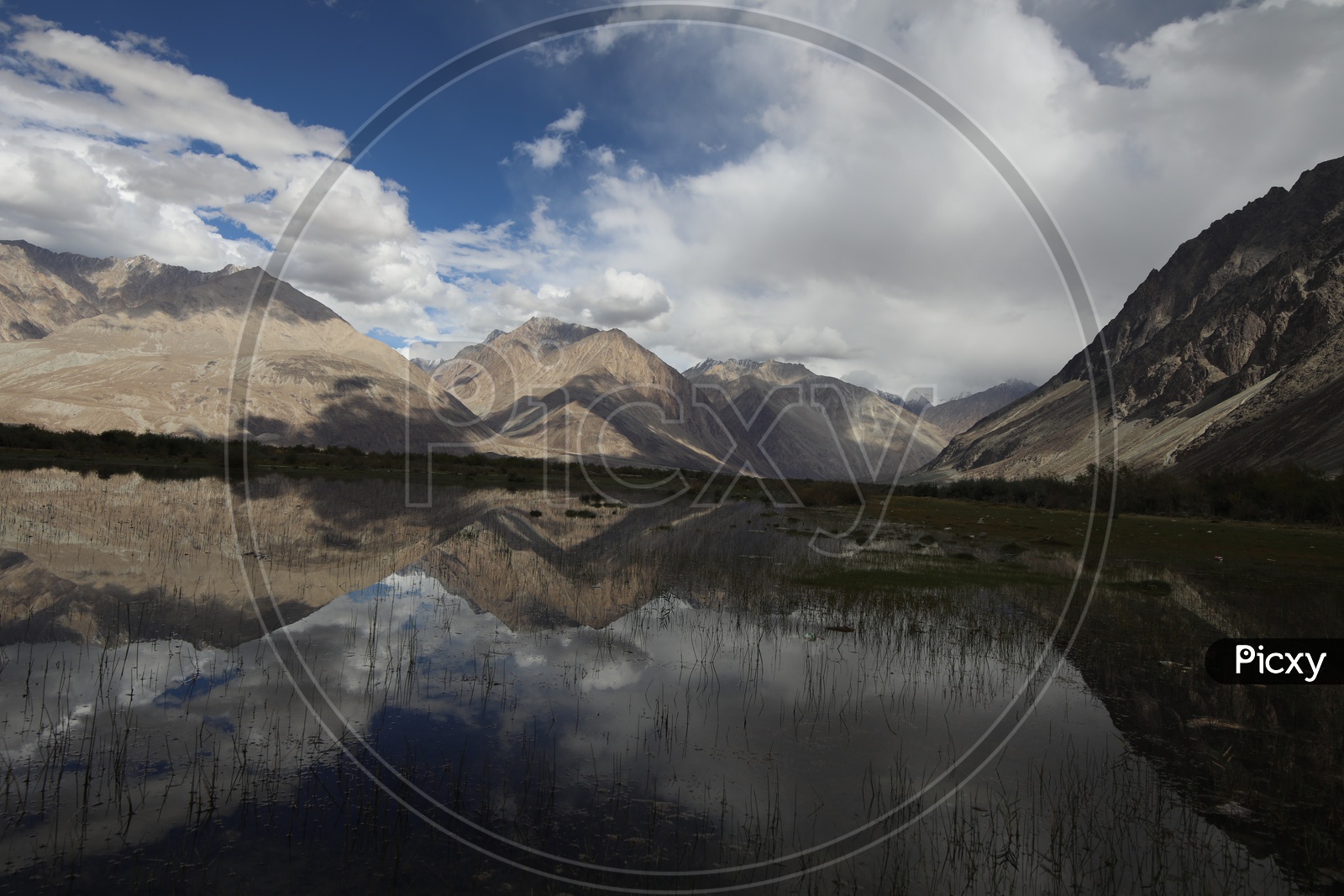 Image of A Beautiful Reflection of Mountains in Water in River valleys ...