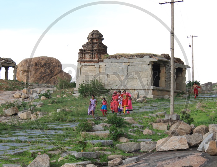 Image of Temples of Hampi with people in the foreground-ZV023093-Picxy