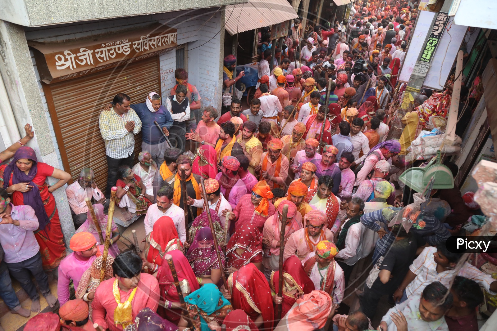 Image of Indian Hindu Devotees Celebrating Lathmar Holi By Women ...