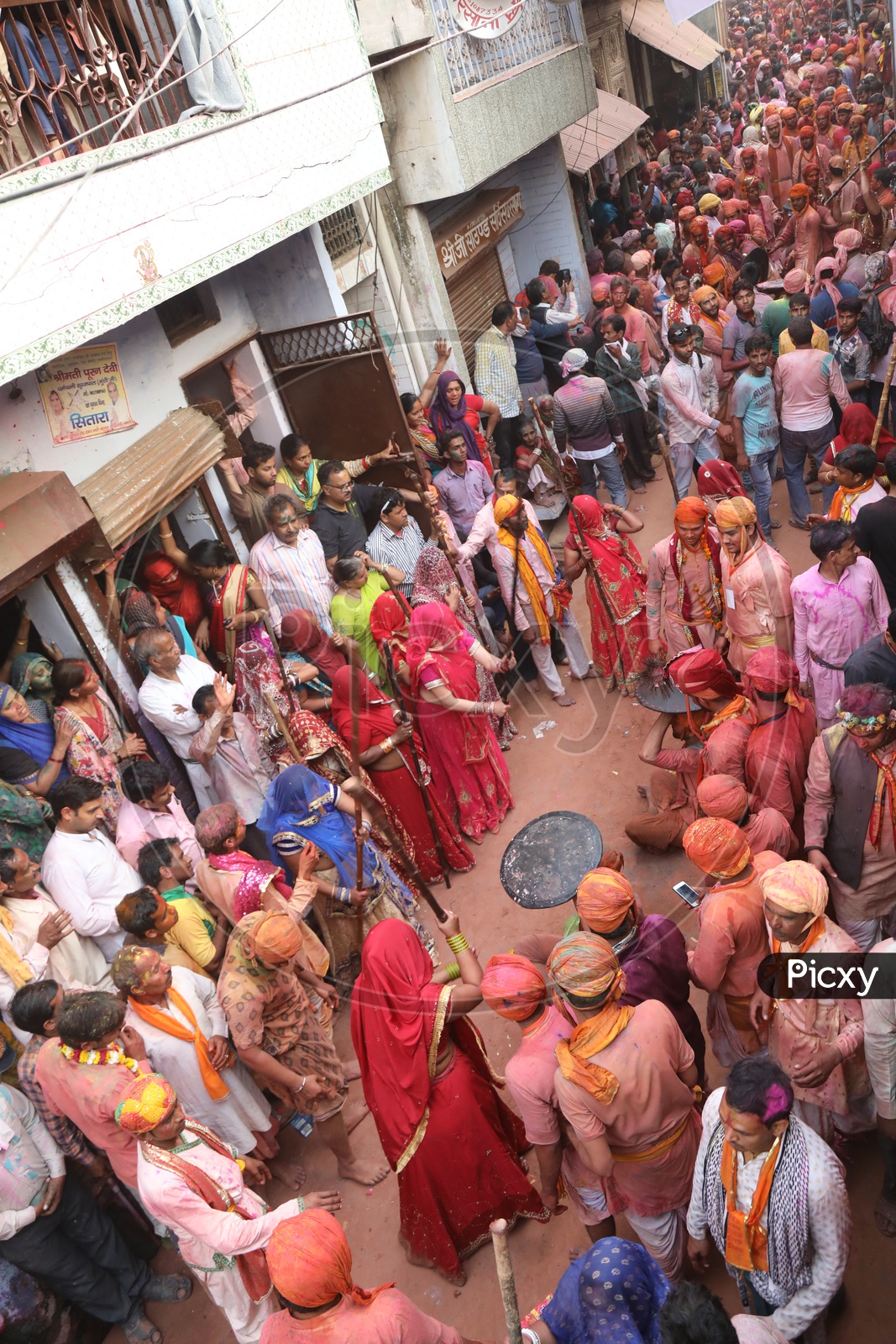 Image of Indian Hindu Devotees Celebrating Lathmar Holi By Women ...