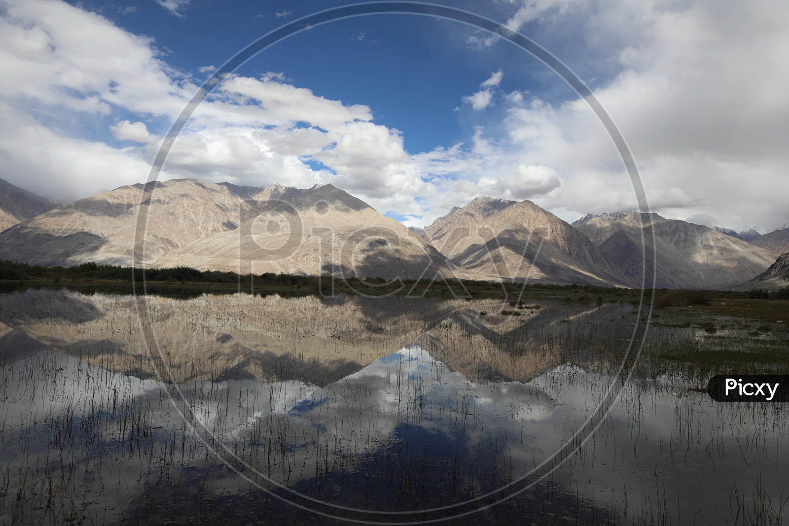 Image of A Beautiful Reflection of Mountains in Water in River valleys ...