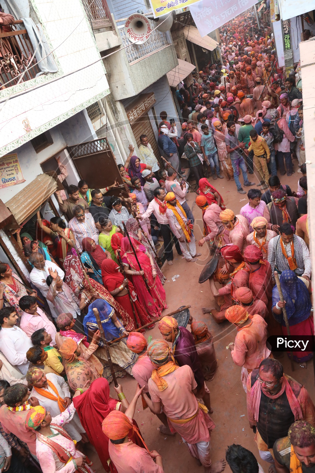 Image of Indian Hindu Devotees Celebrating Lathmar Holi By Women ...
