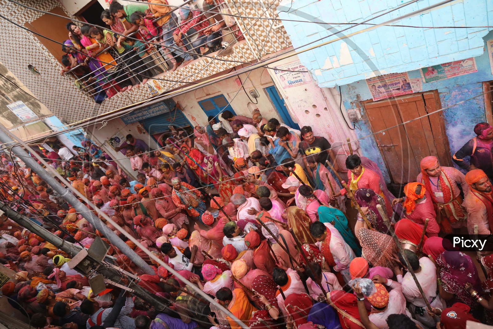 Image of Indian Hindu Devotees Celebrating Lathmar Holi By Women ...