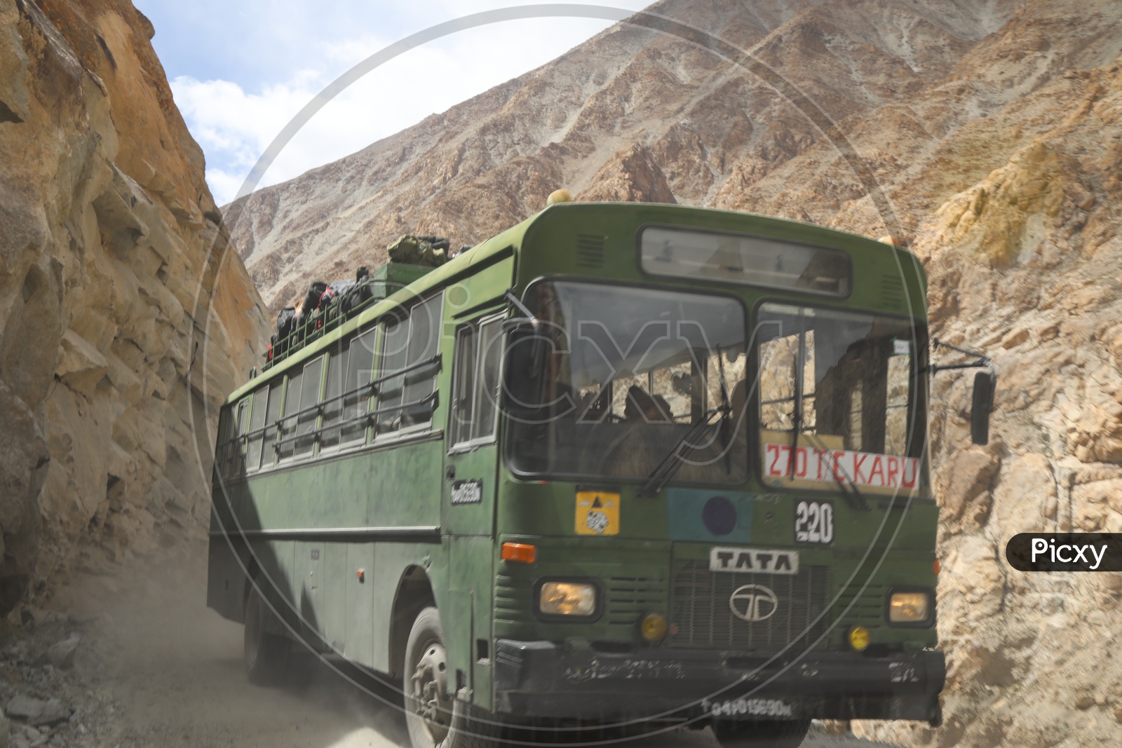 Image of An Indian Army Regiment Bus In The Valley Roads Of Leh-FG244065-Picxy