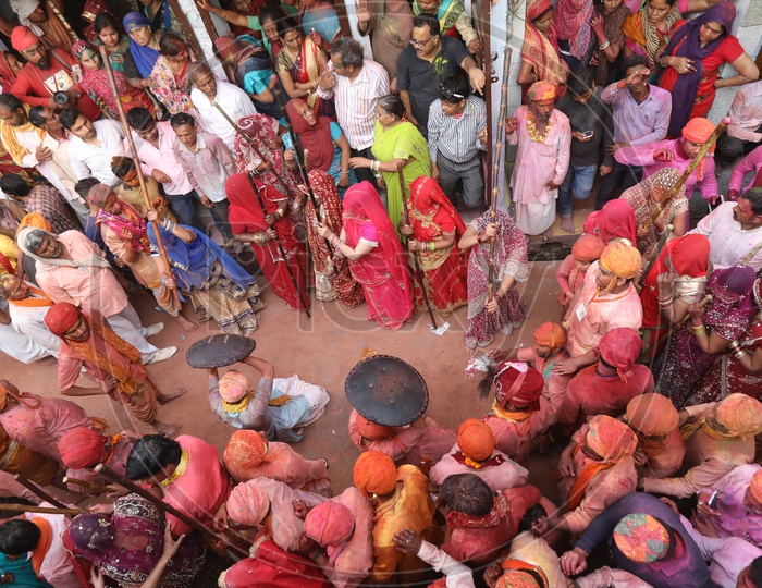 Image of Indian Hindu Devotees Celebrating Lathmar Holi By Women ...