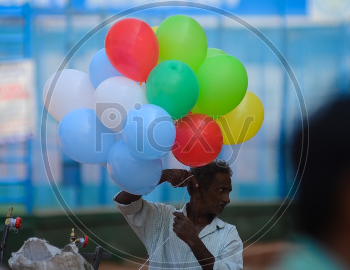 Image of Balloon maker, balloon seller, colorful balloons-OH929720-Picxy