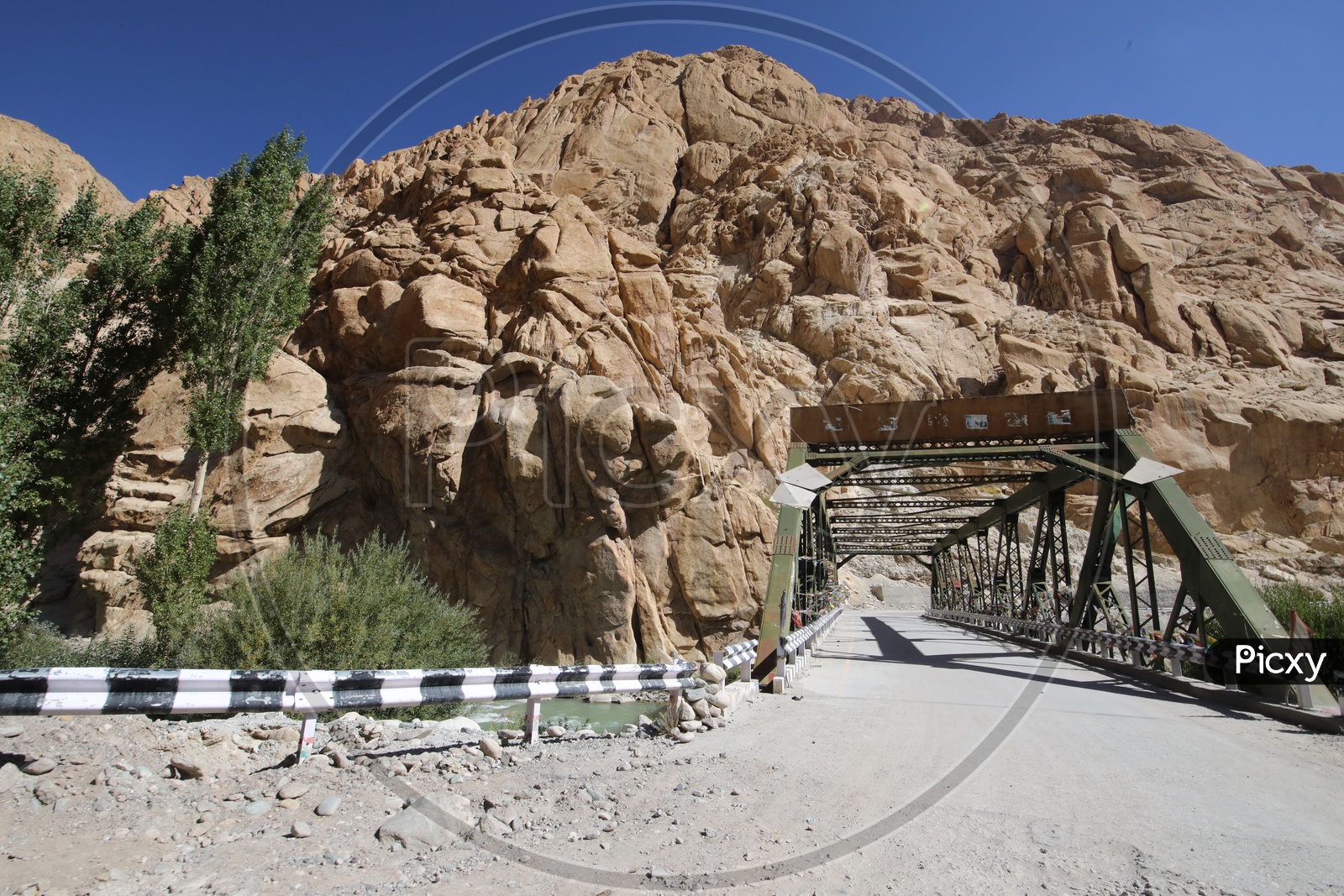 Image of A Metal Bridge Constructed Over a Water channel in Leh ...