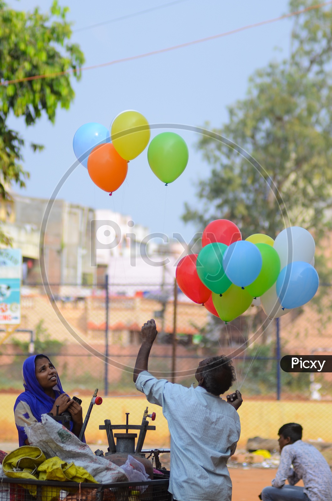 Image of Balloon maker, balloon seller, colorful balloons-XE509501-Picxy