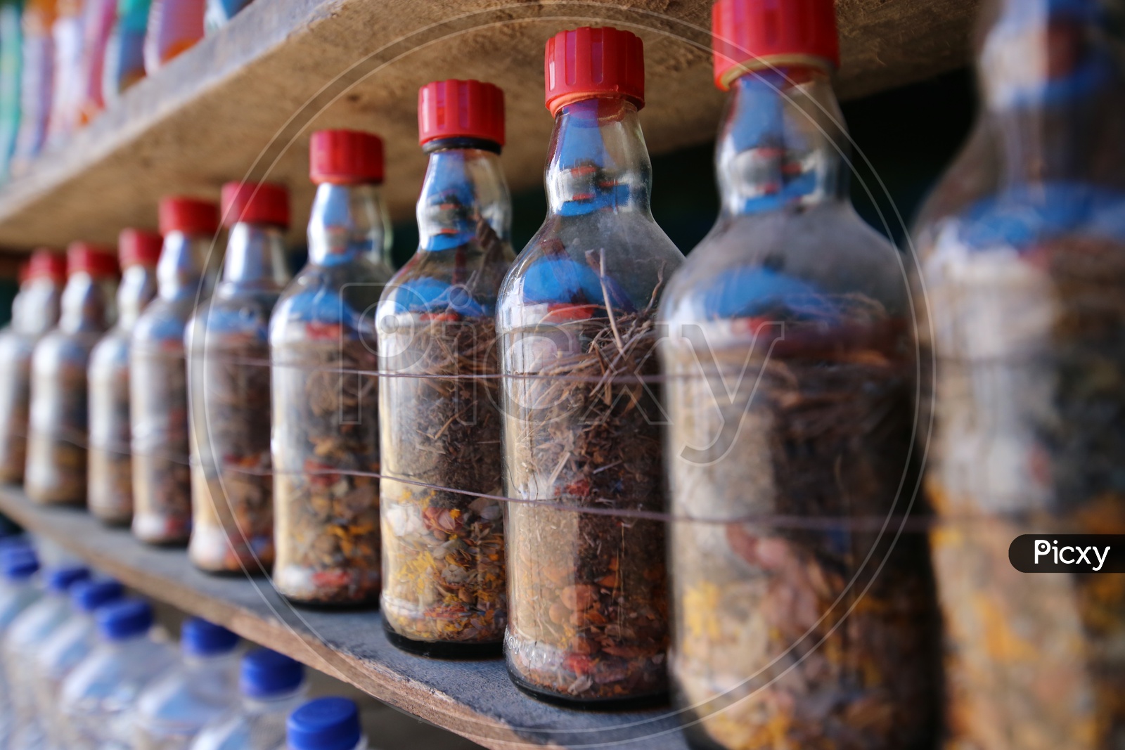Image of Kerala Ayurvedic Bottles With Various Roots and Spices Closeup ...