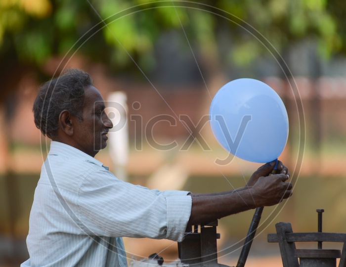Image of Balloon maker, balloon seller, colorful balloons-OH929720-Picxy