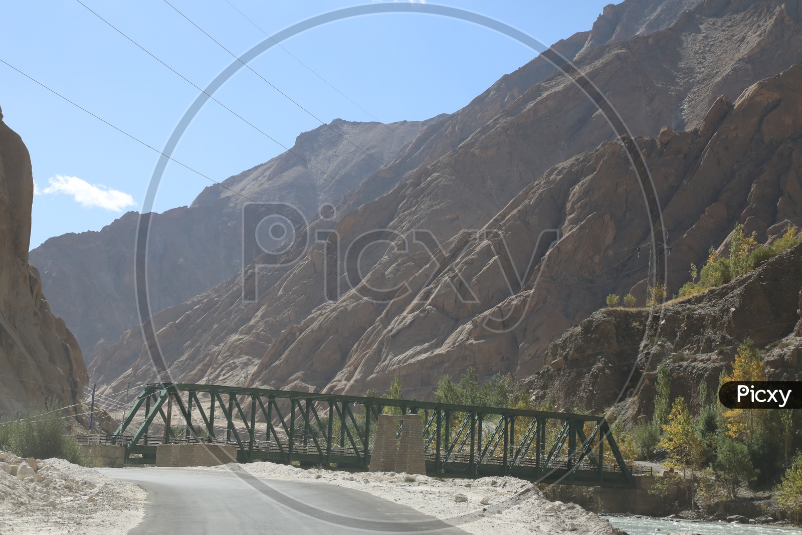 Image of A Composition shot of a metal bridge and a valley in Leh ...