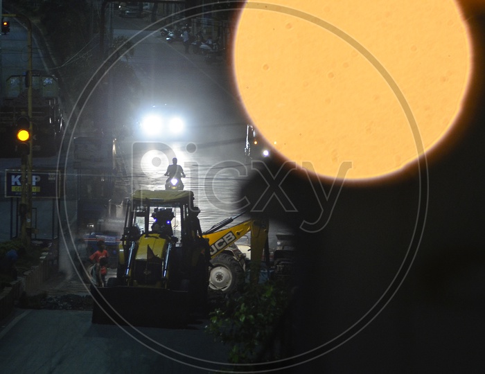 Image of Proclainer working at night-EN818935-Picxy