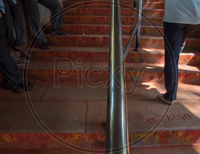 Image of 1250 step mark, a man walks past the mark as few tired ...