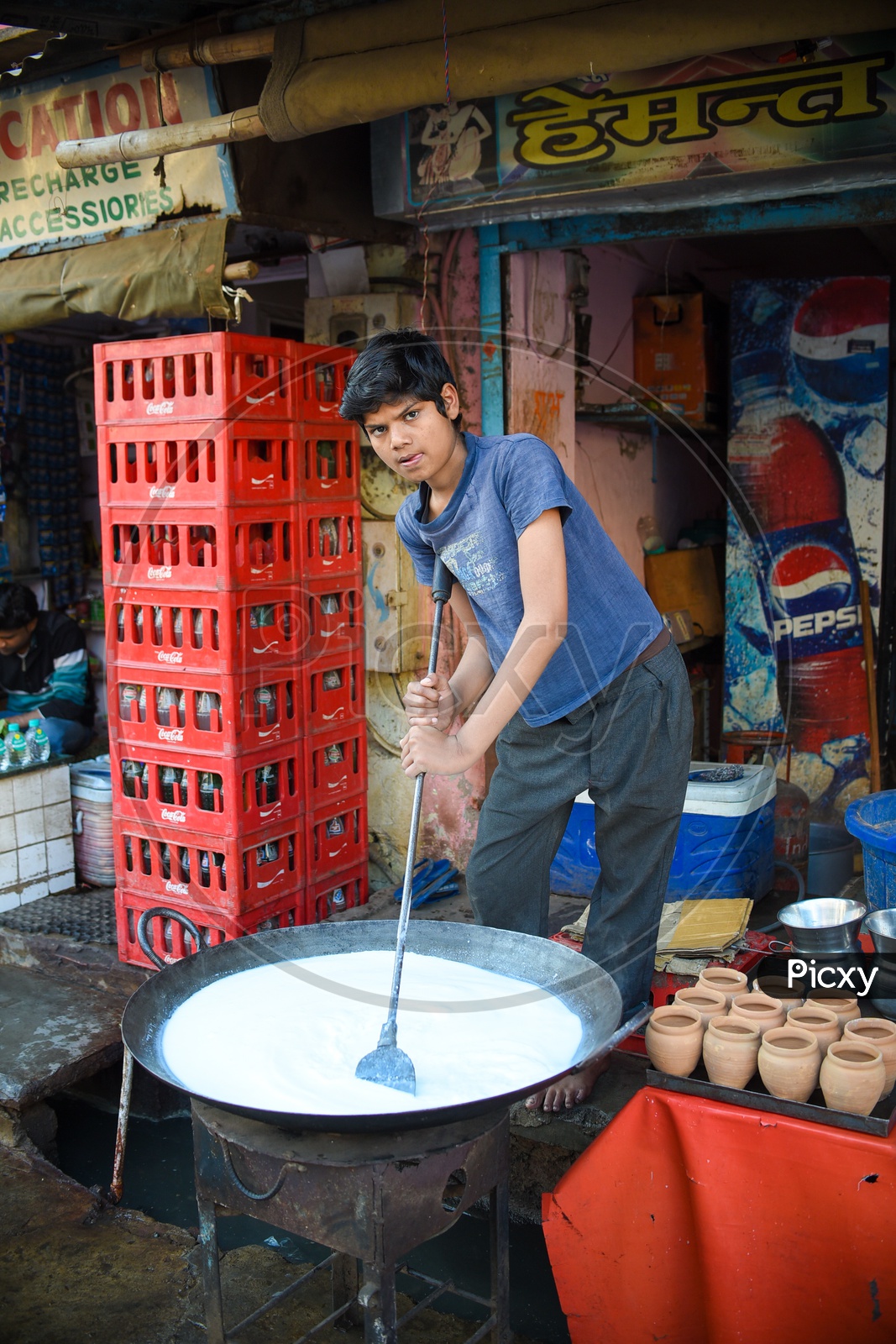 Image of Milk Vendor in streets of Vrindavan-EL411780-Picxy