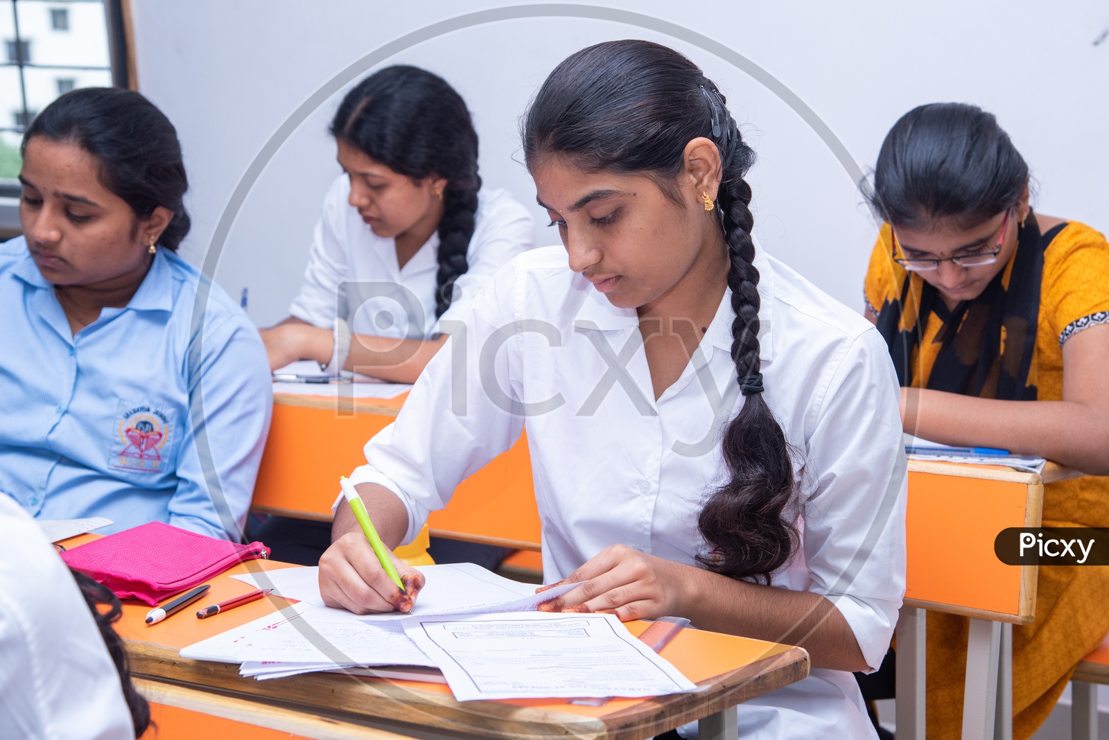 Image of Student writing an exam at an educational institution-ET216294 ...