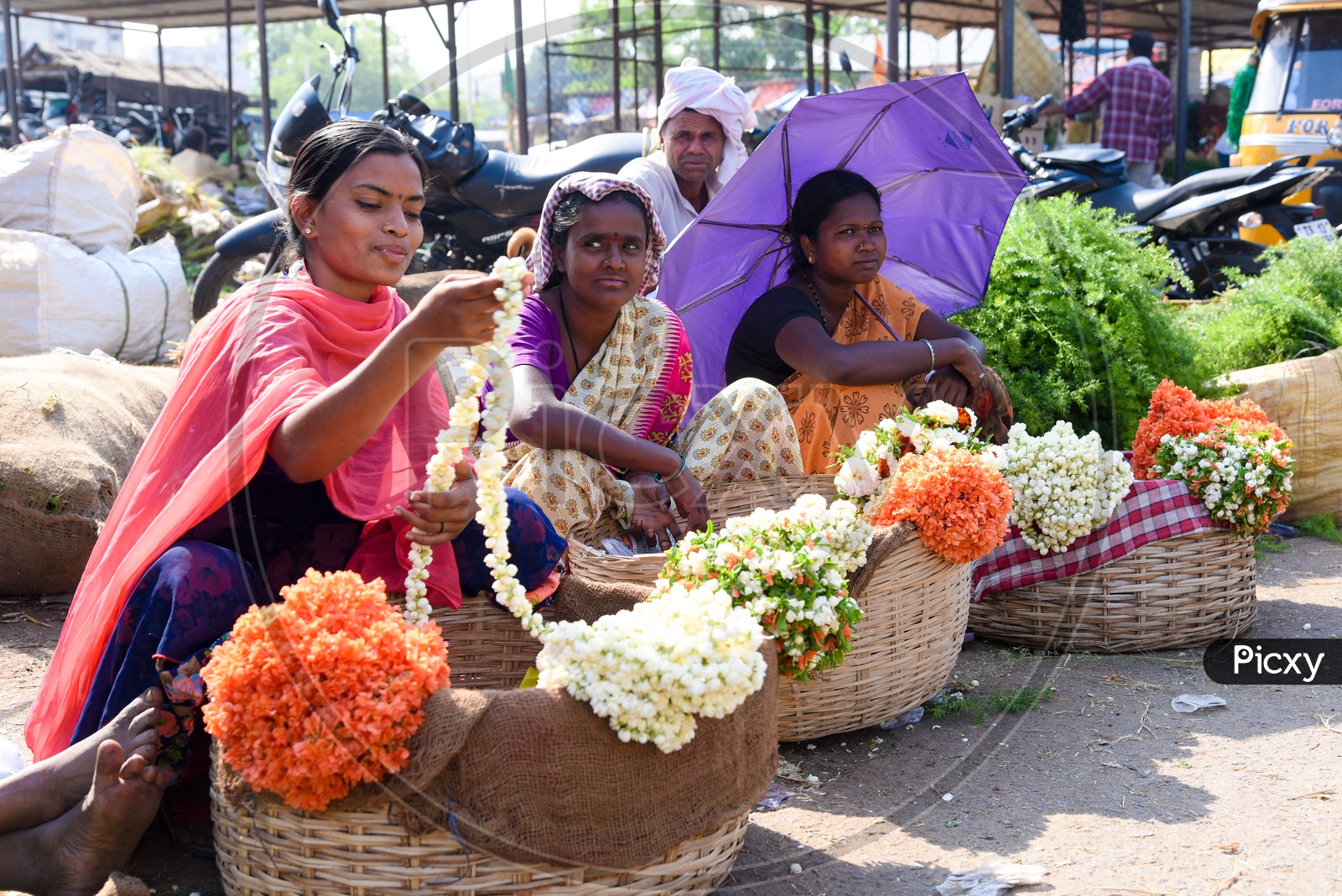 Image of Flower vendors at Gudimalkapur flower market-XR903246-Picxy