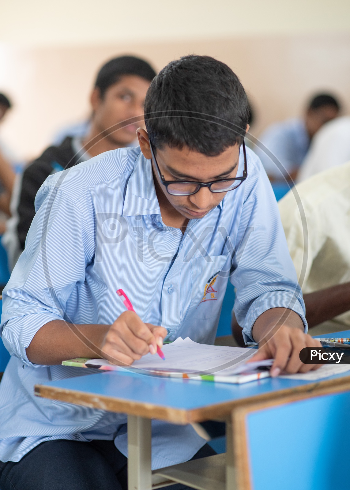 Image of Student writing exam at an educational institute in Telangana ...