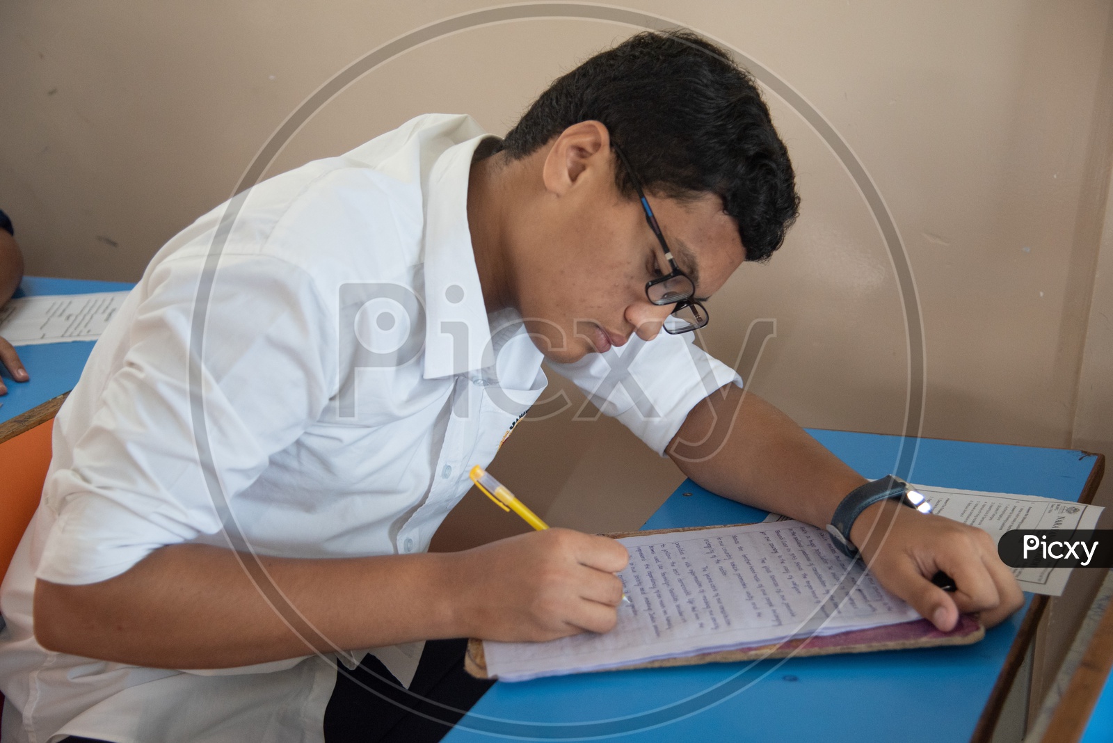 Image of Boy writing his exam at an educational institute in Hyderabad ...