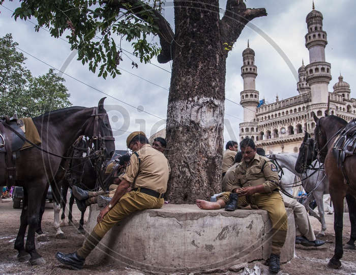 Image of Police Officers resting under a tree-VL470381-Picxy