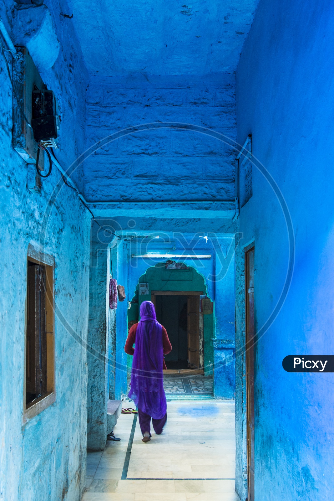 Image of Rajasthani Woman in Blue House at Osian, Jodhpur-KY875855-Picxy