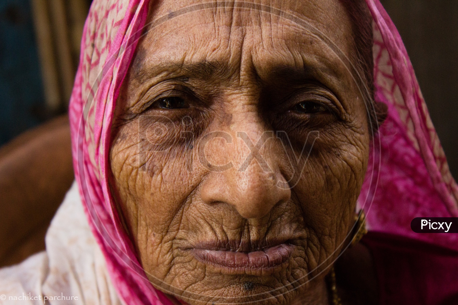 Image of An old lady staring at the camera-JP987875-Picxy