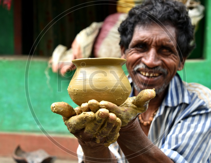Image of Happy Pot Maker and Clay Pots-FM547377-Picxy