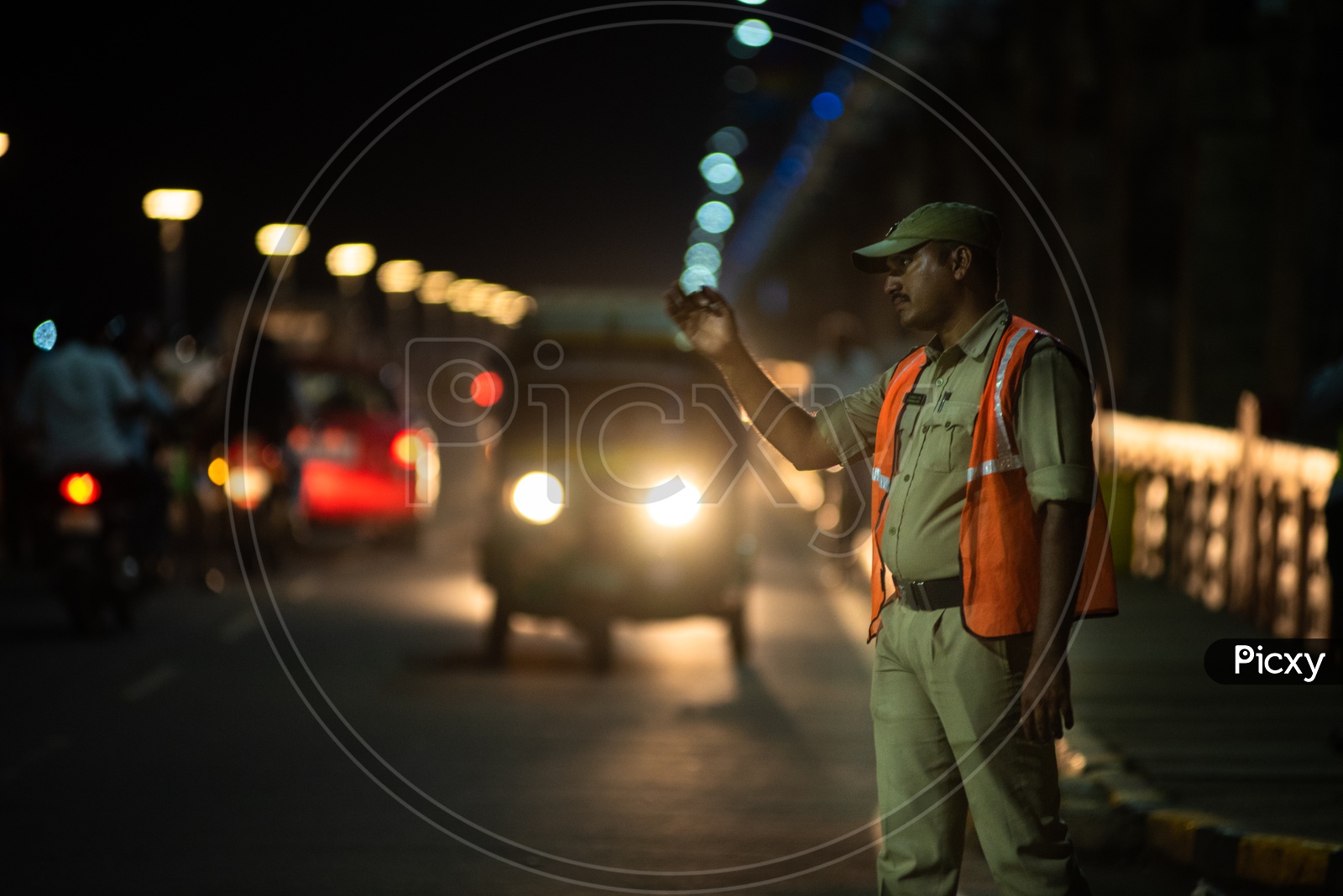 Image of a traffic constable regulating traffic at Prakasam barrage ...