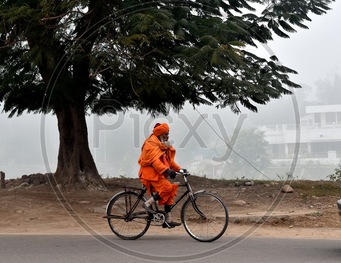 Image of Sadhu on Bicycle-OT390147-Picxy