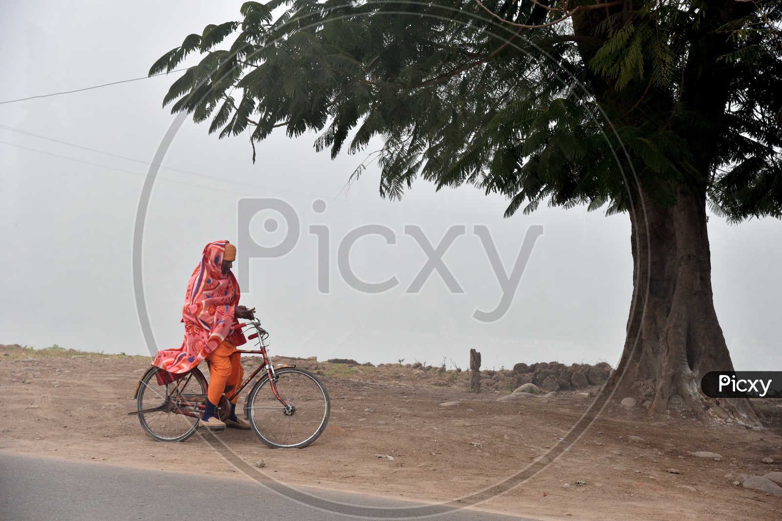 Image of Sadhu on Bicycle-OT390147-Picxy