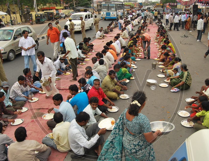 Image of People eating food on road-JU465345-Picxy