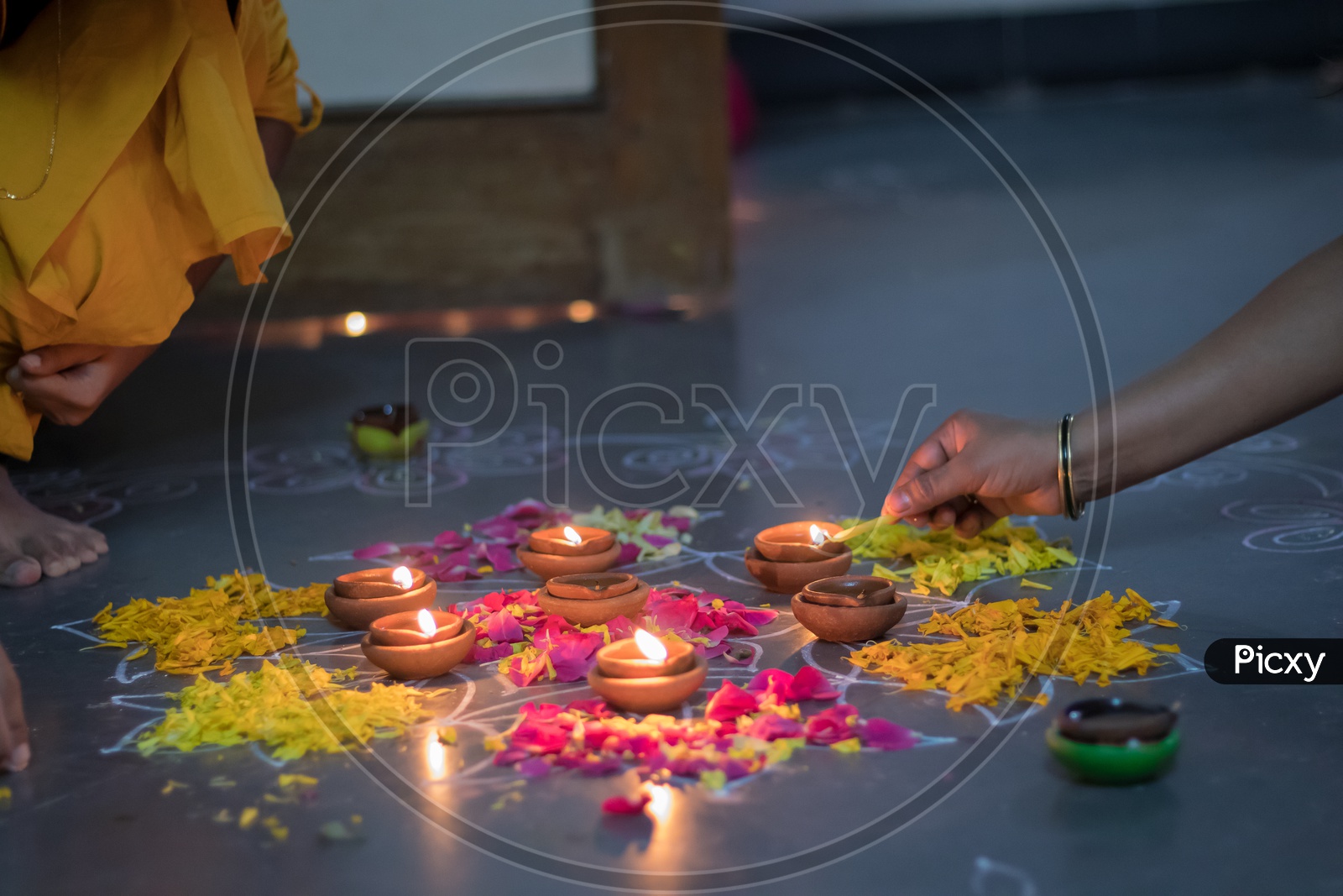 Image Of Indian Hindu Festival Diwali Dias Lighting Up By Women Closeup