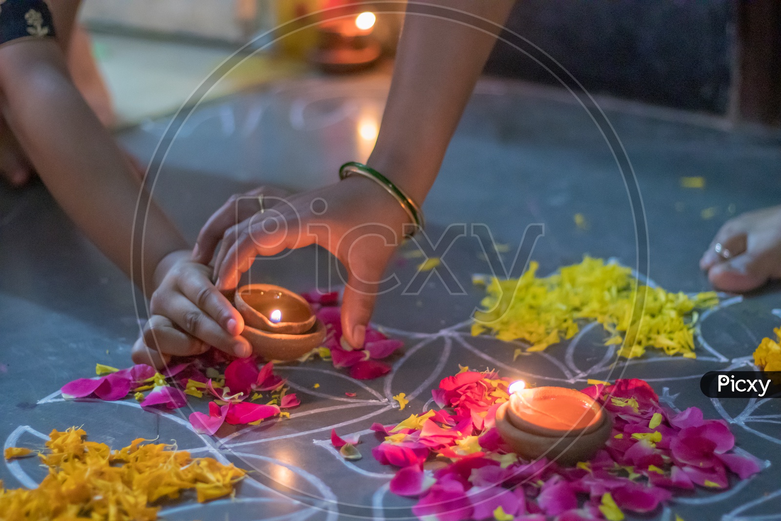 Image Of Indian Hindu Festival Diwali Dias Lighting Up By Women Closeup